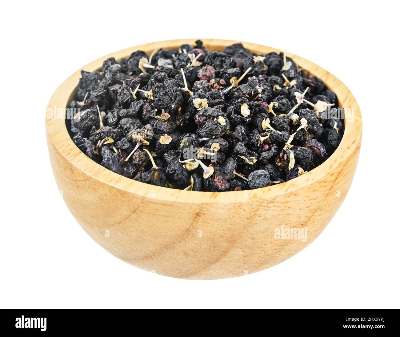 Dried Black wolfberries or black goji berries in wooden bowl isolated ...