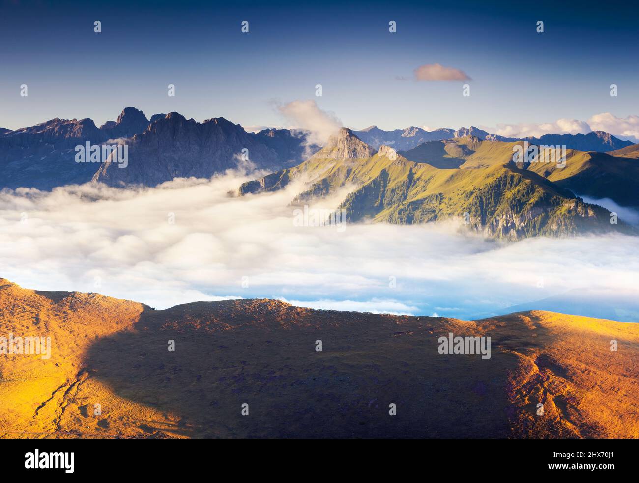 Great view of the foggy Val di Fassa valley with passo Sella. National ...