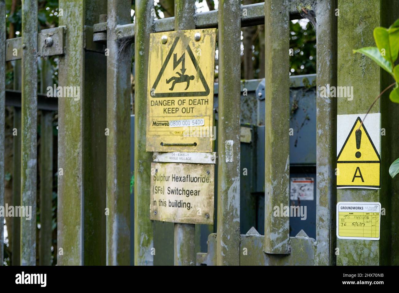 Yellow warning sign, danger of death Stock Photo - Alamy