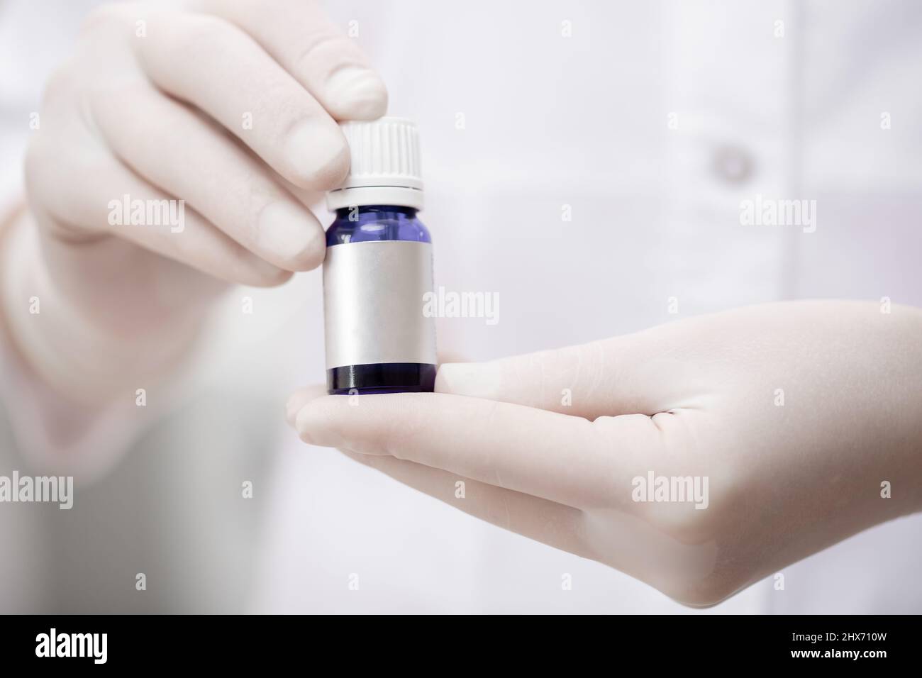 Liquid for face rejuvenation in jar with injection in hands of doctor ...