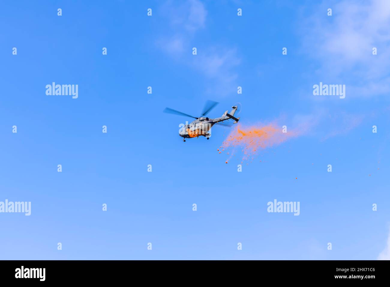 An Indian Air Force Dhruv helicopter drops flower petals on the people ...