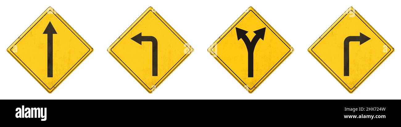Four yellow signs with arrows on a white background Stock Photo - Alamy