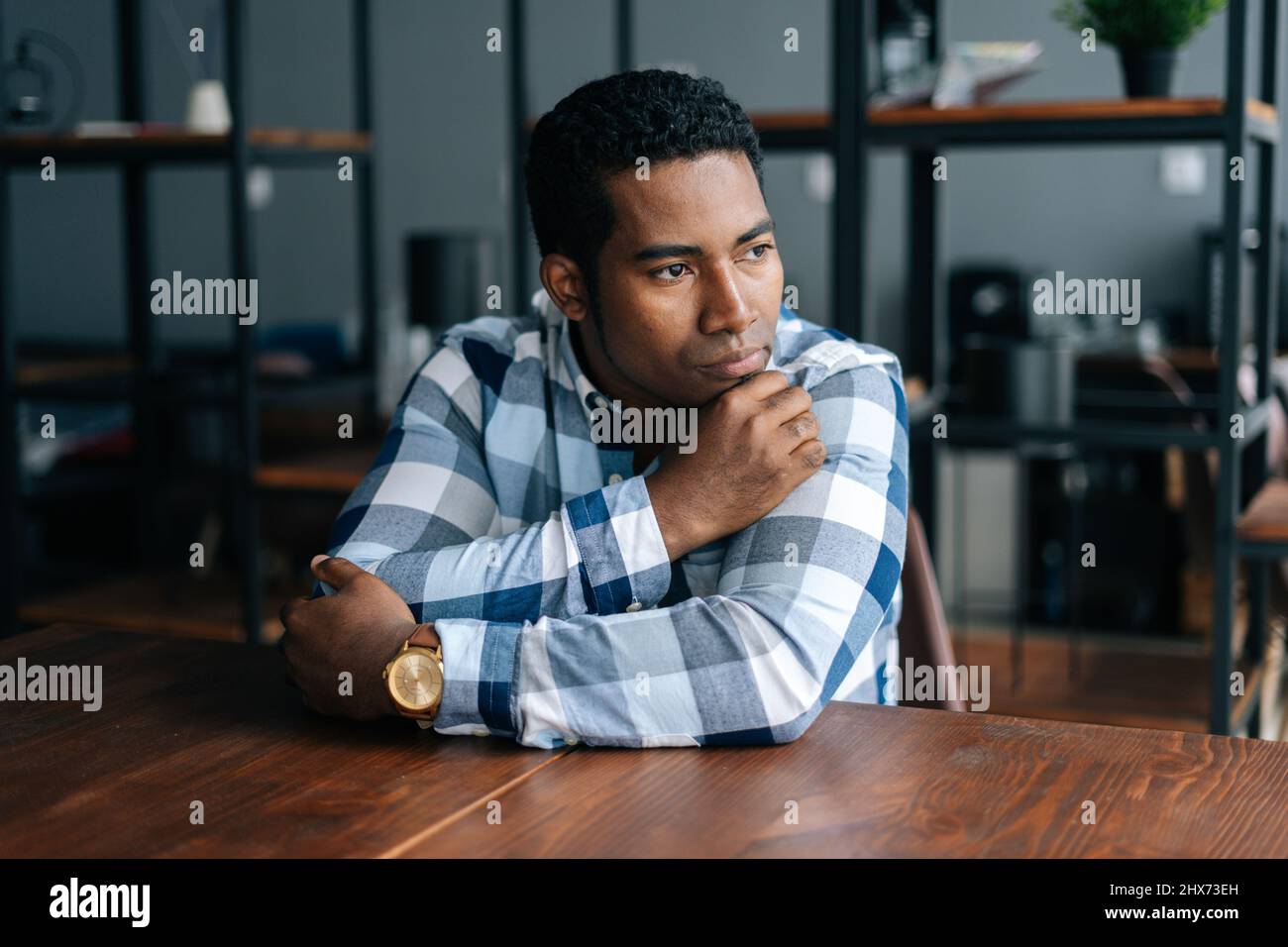 Close-up portrait of thoughtful depressed African American businessman ...