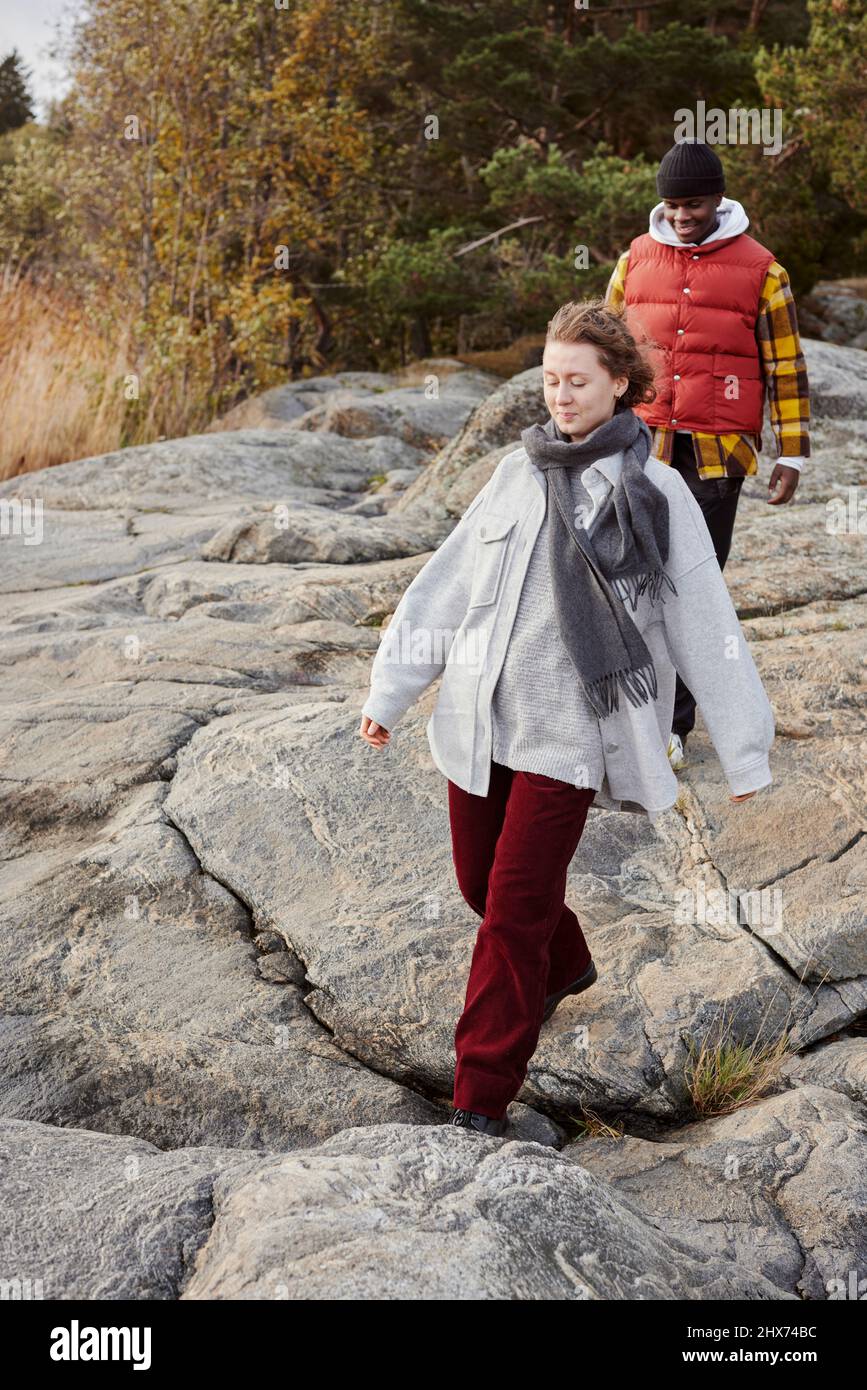 Women in front of rocks hi-res stock photography and images - Alamy