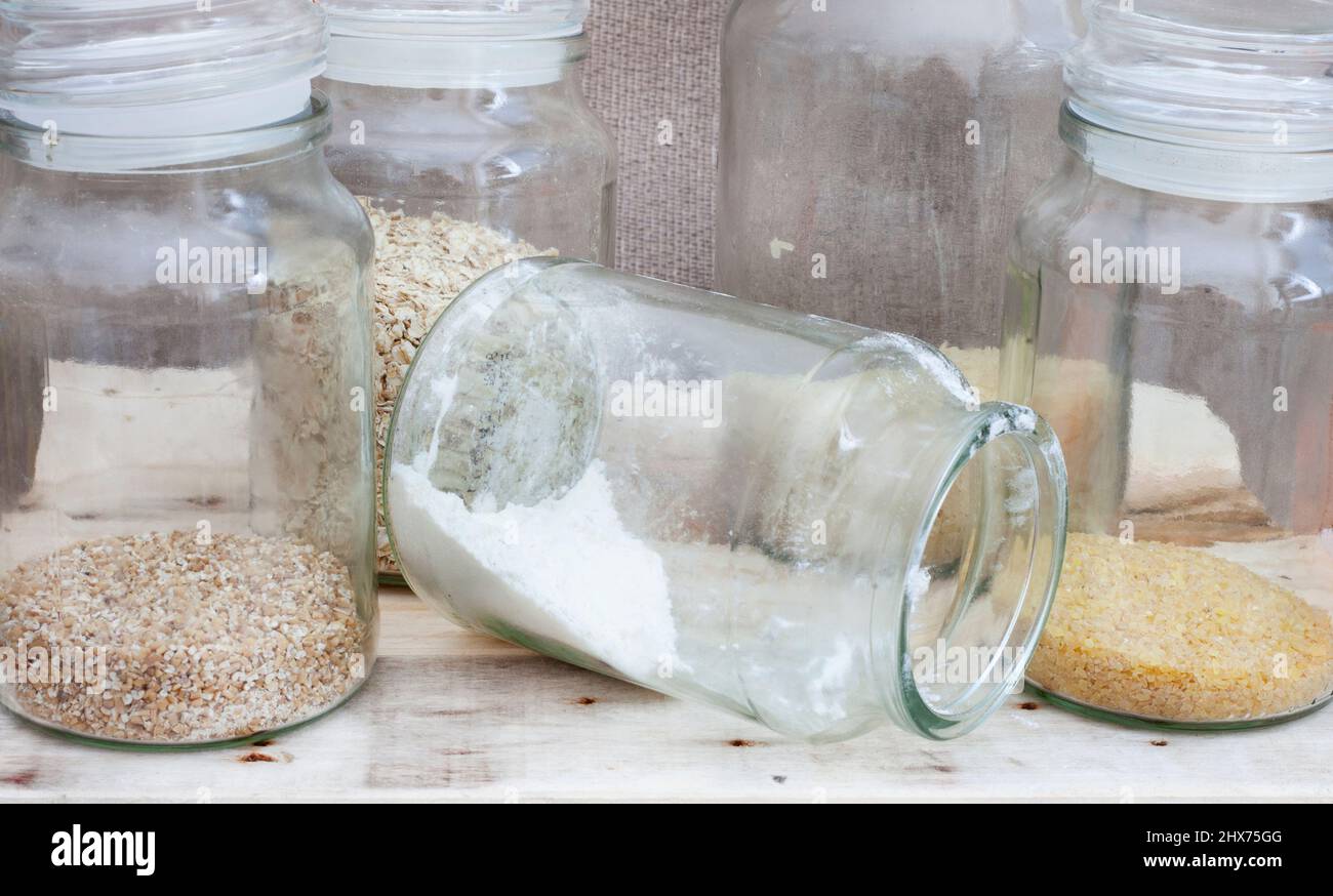 Glass jars with basic pantry stock almost finished Stock Photo - Alamy