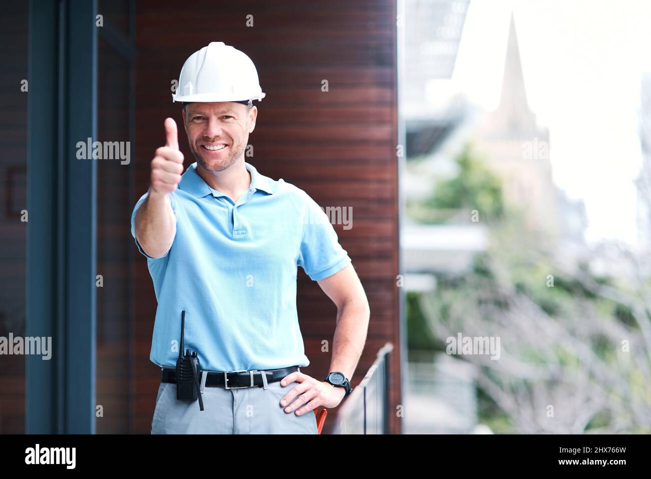 Were all set to get going. Portrait of a cheerful engineer posing with ...