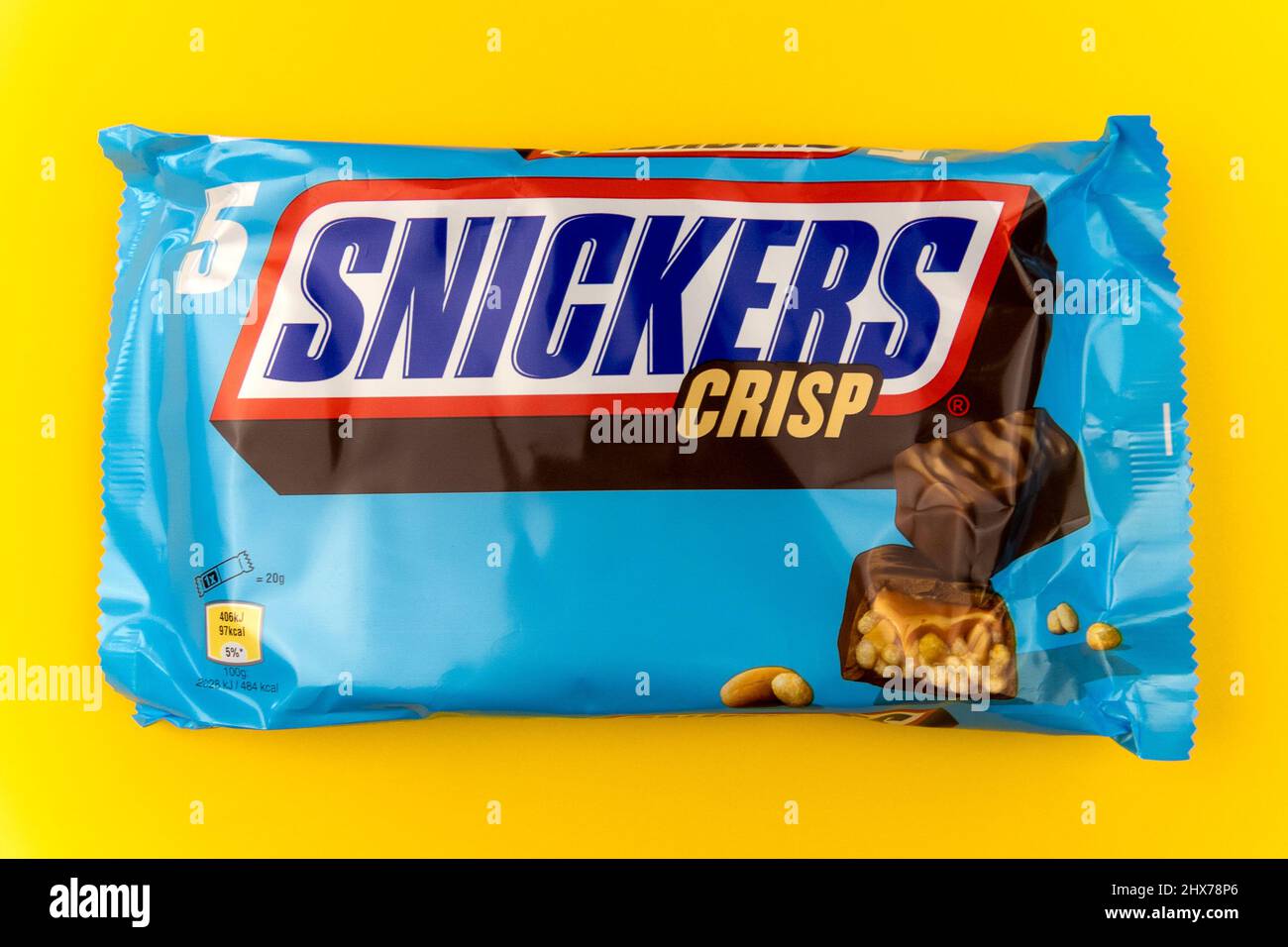 packet of crisp snickers isolated on a yellow background Stock Photo ...
