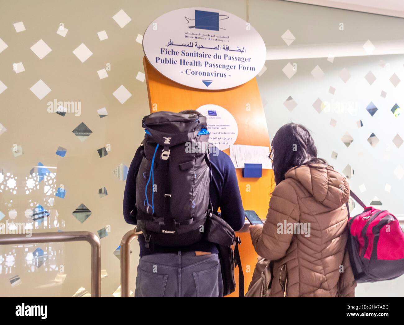 Public Health passenger form stand, covid-19 regulations, tourists in ...