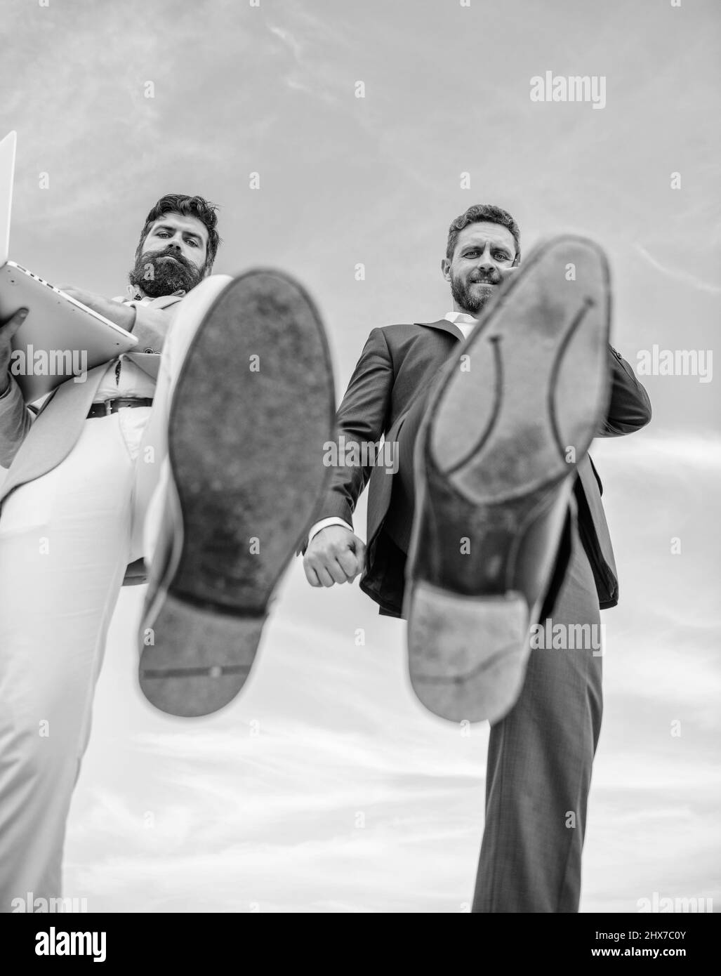 Business partner busy with phone call moving forward, foot shoe close ...