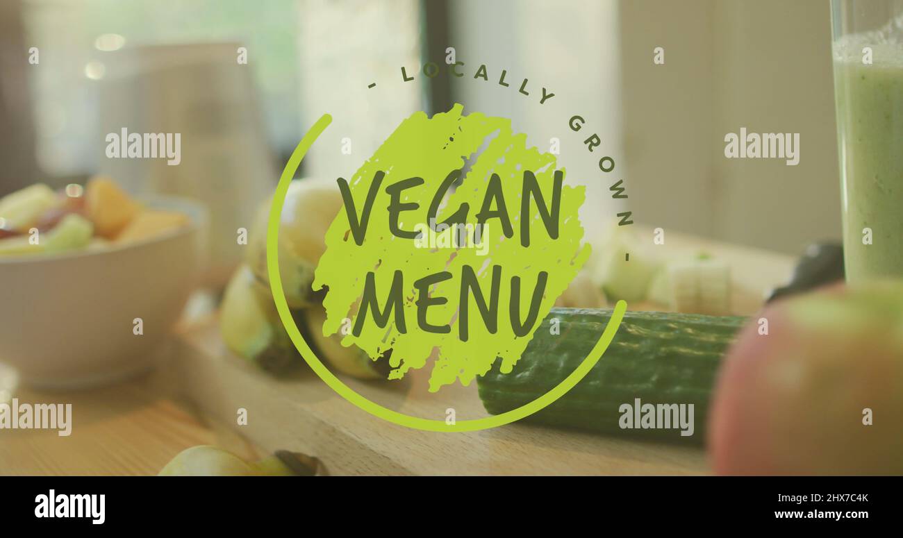 Image of vegan menu text over fruit in kitchen. national vegetarian ...