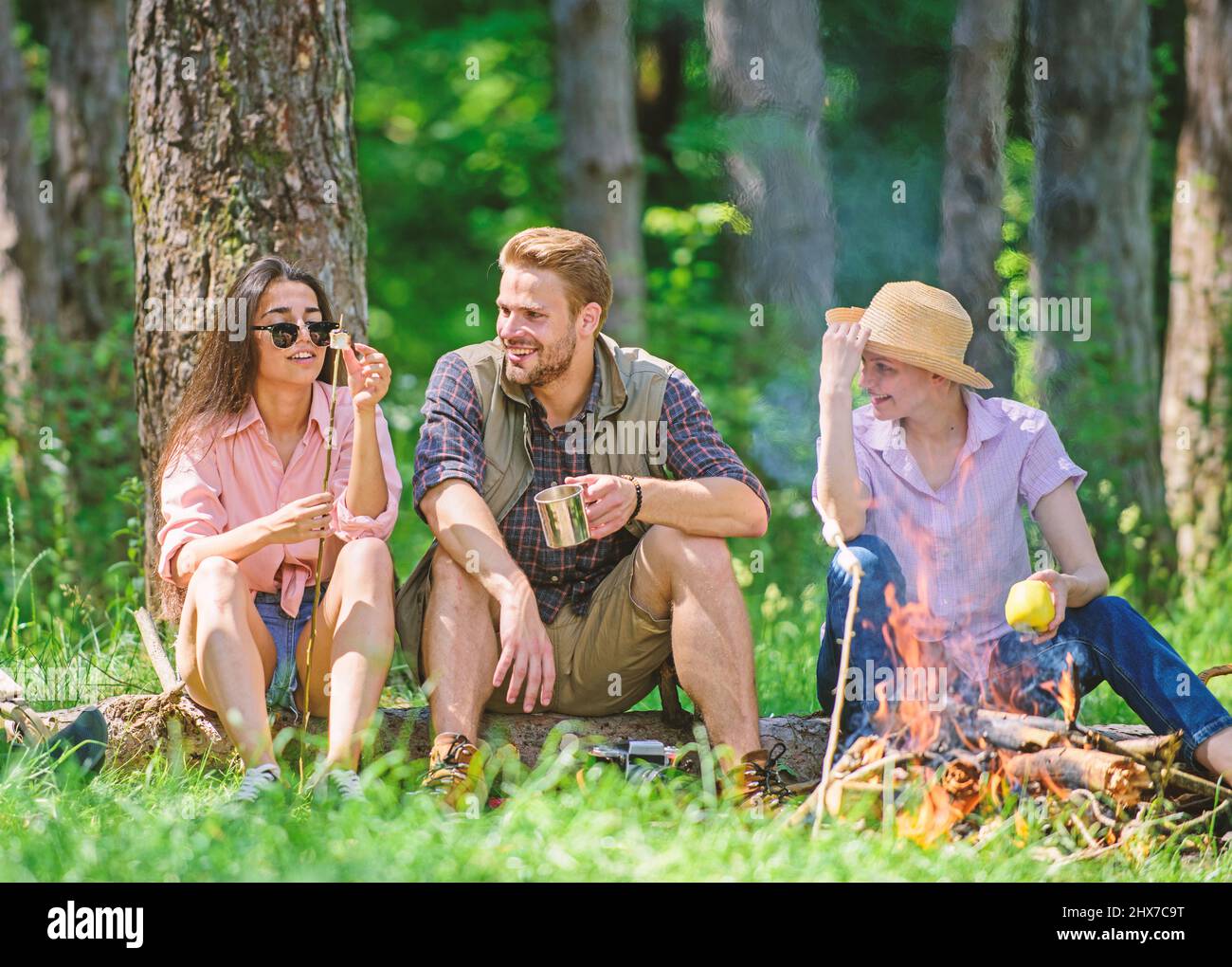Camping and hiking. Halt for snack during hiking. Company friends ...