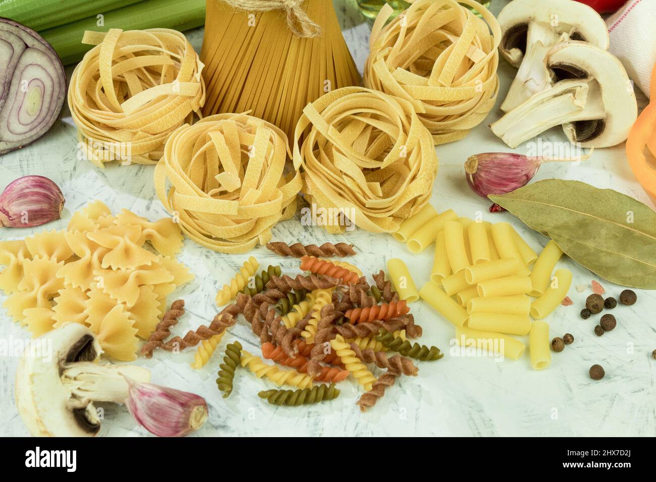 Assorted different types of pasta on the table. Various types of raw ...