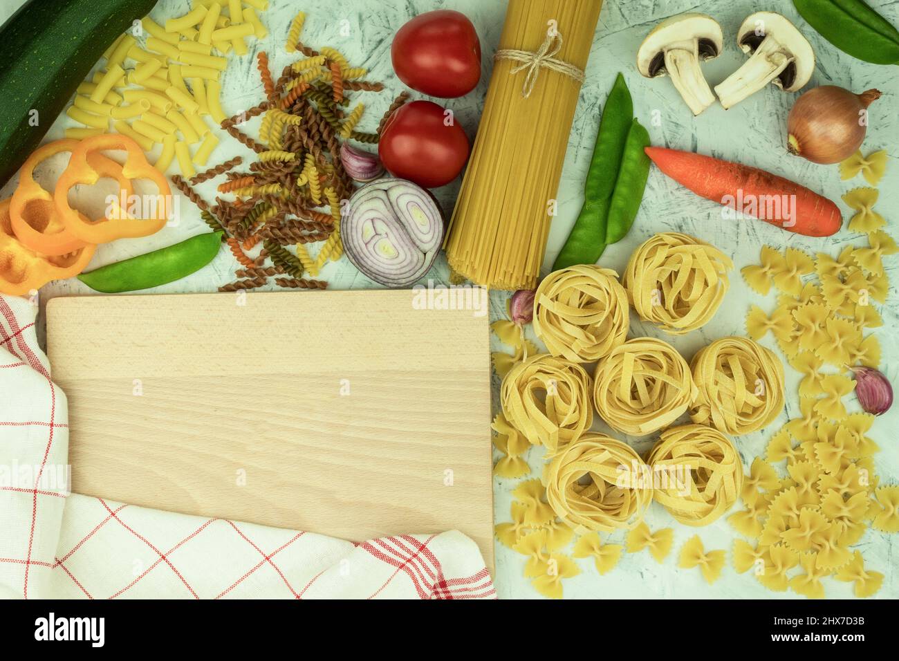 Assorted different types of pasta on the table. Various types of raw ...