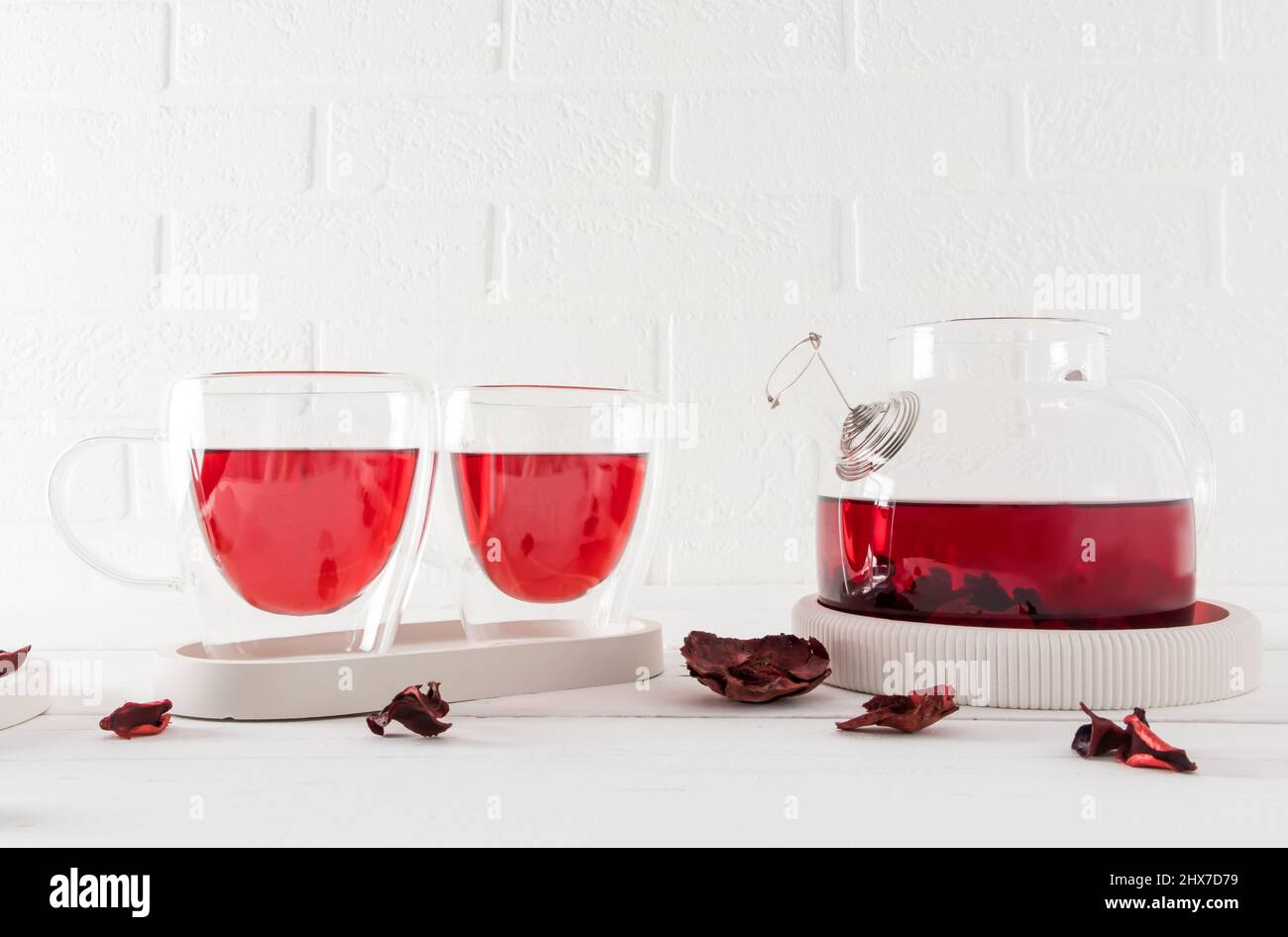 tea ceremony. a teapot and two modern double-bottomed glass cups with ...