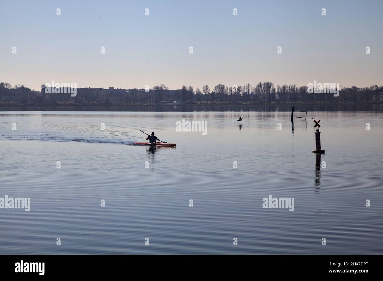 Canoe on a lake with buoys on a sunny day Stock Photo - Alamy