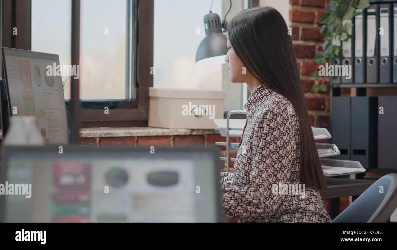 Close up of woman working on business startegy with computer in office ...