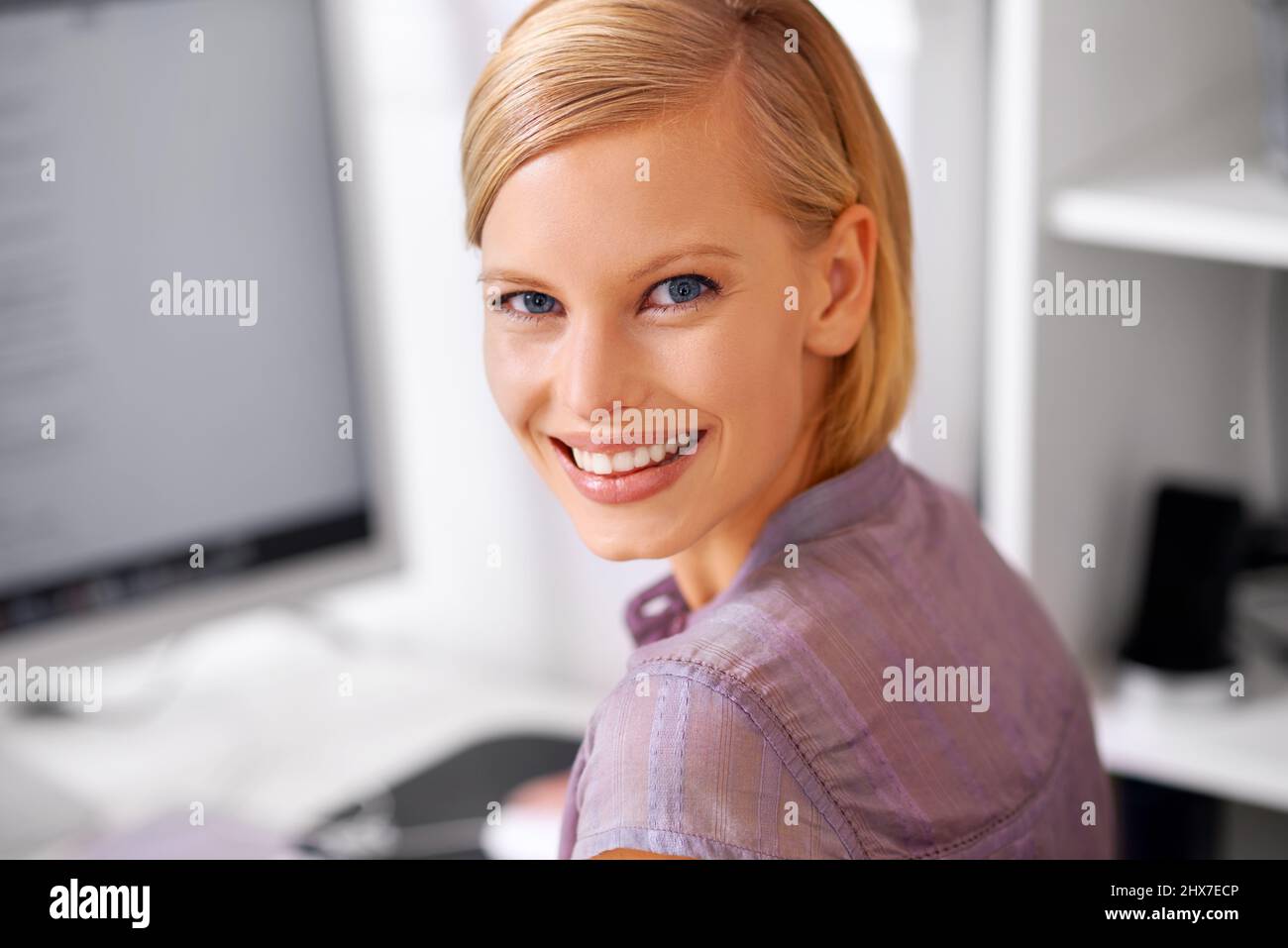 Keeping it positive. Portrait of a beautiful young woman sitting at her ...