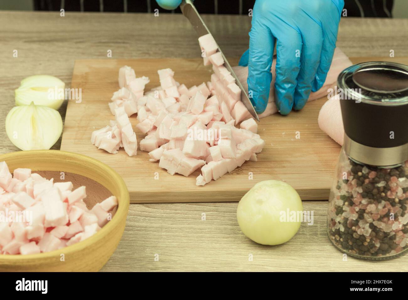 Fresh and raw lard finely chopped, meat on a cutting board. Salo ready ...