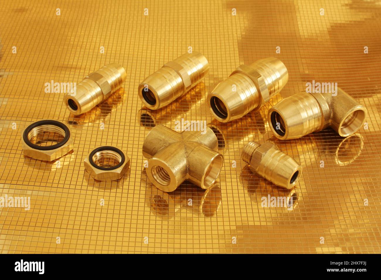 Sealing elements. Metal parts on yellow background Stock Photo - Alamy