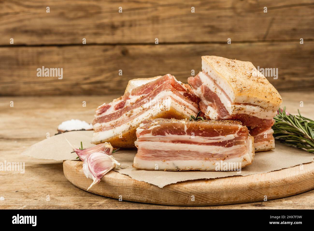 Pieces of salty high-fat meat cooked with spices. Salo, bacon, lard ...