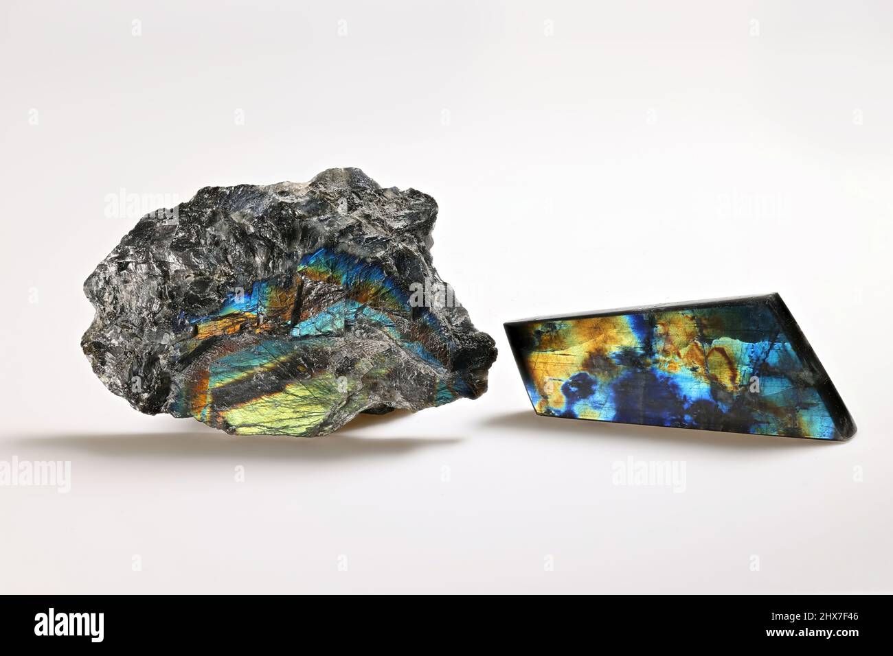 Uncut rough crystals and polished slab of colorful spectrolite ...