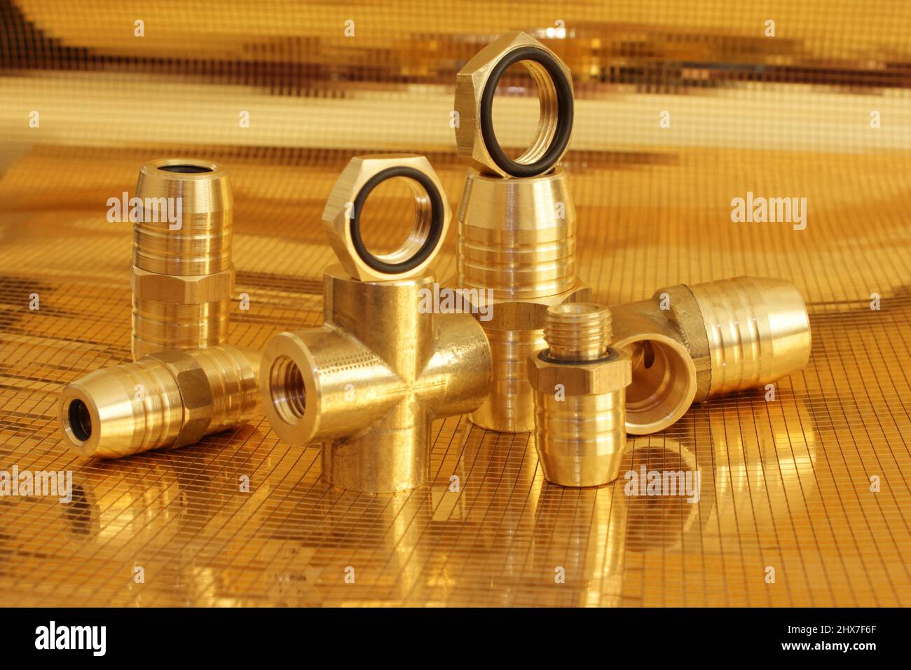 Sealing elements. Metal parts on yellow background Stock Photo - Alamy