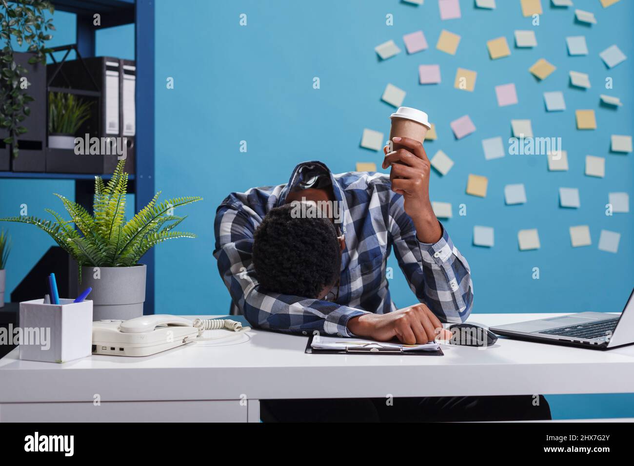 Stressed and fatigued team leader with burnout syndrome sitting in ...
