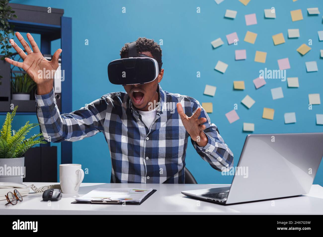 Research agency amazed surprised employee playing with VR technology ...