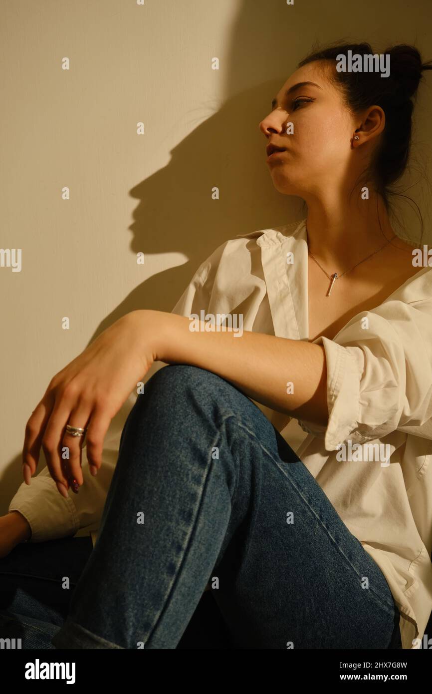 serious young woman feeling sad and scared with closed eyes, depressed ...