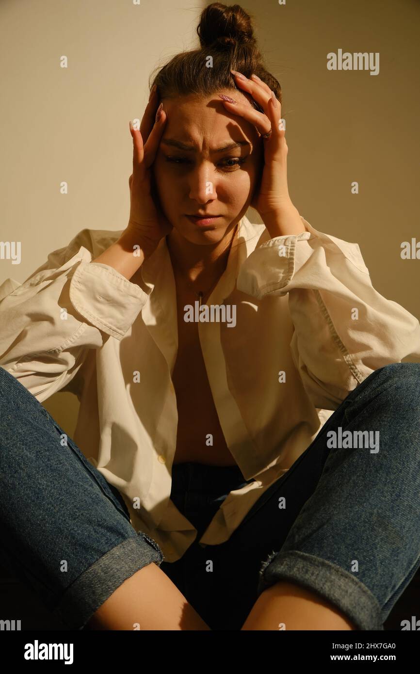 serious young woman feeling sad and scared with closed eyes, depressed ...