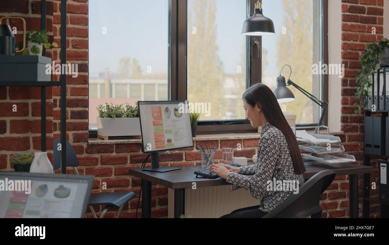 Employee working with business charts design on computer. Entrepreneur ...