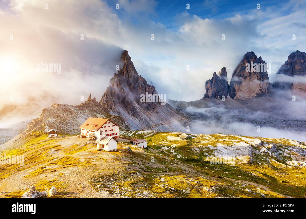 Great foggy view of the National Park Tre Cime di Lavaredo with rifugio ...