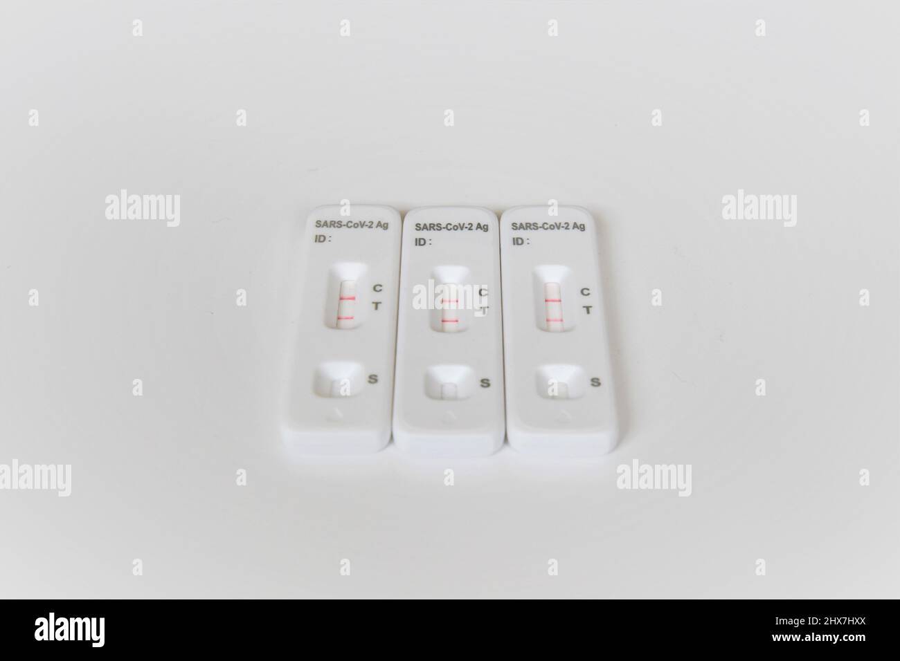 Three positive COVID-19 antigen, lateral flow, self tests. White tests ...