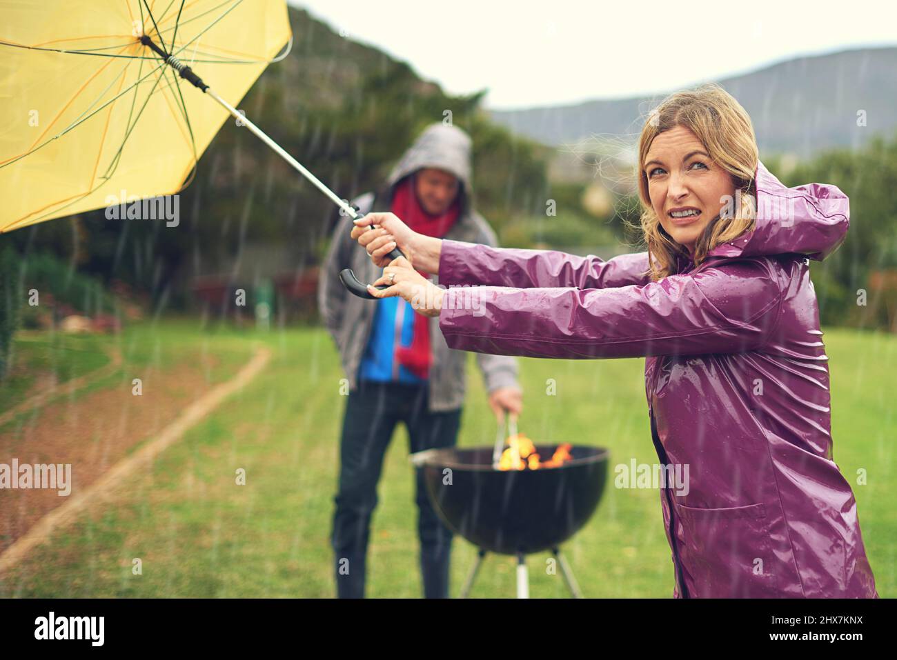 I think its clearing up. Shot of a couple trying to barbecue in the ...