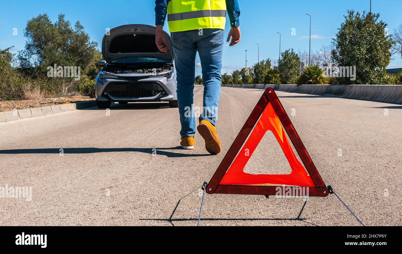 Car standing near stop sign hi-res stock photography and images - Alamy