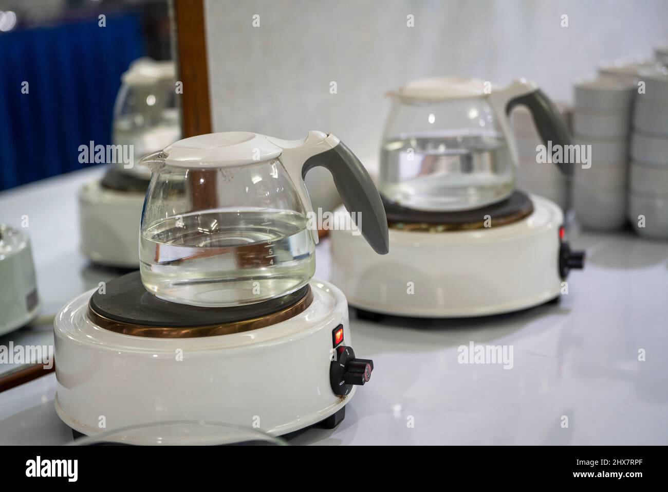 hot water glass pitcher on the electric stove Stock Photo - Alamy