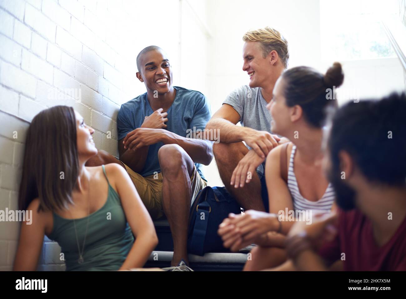 He knows how to make the group laugh. Cropped shot of university ...