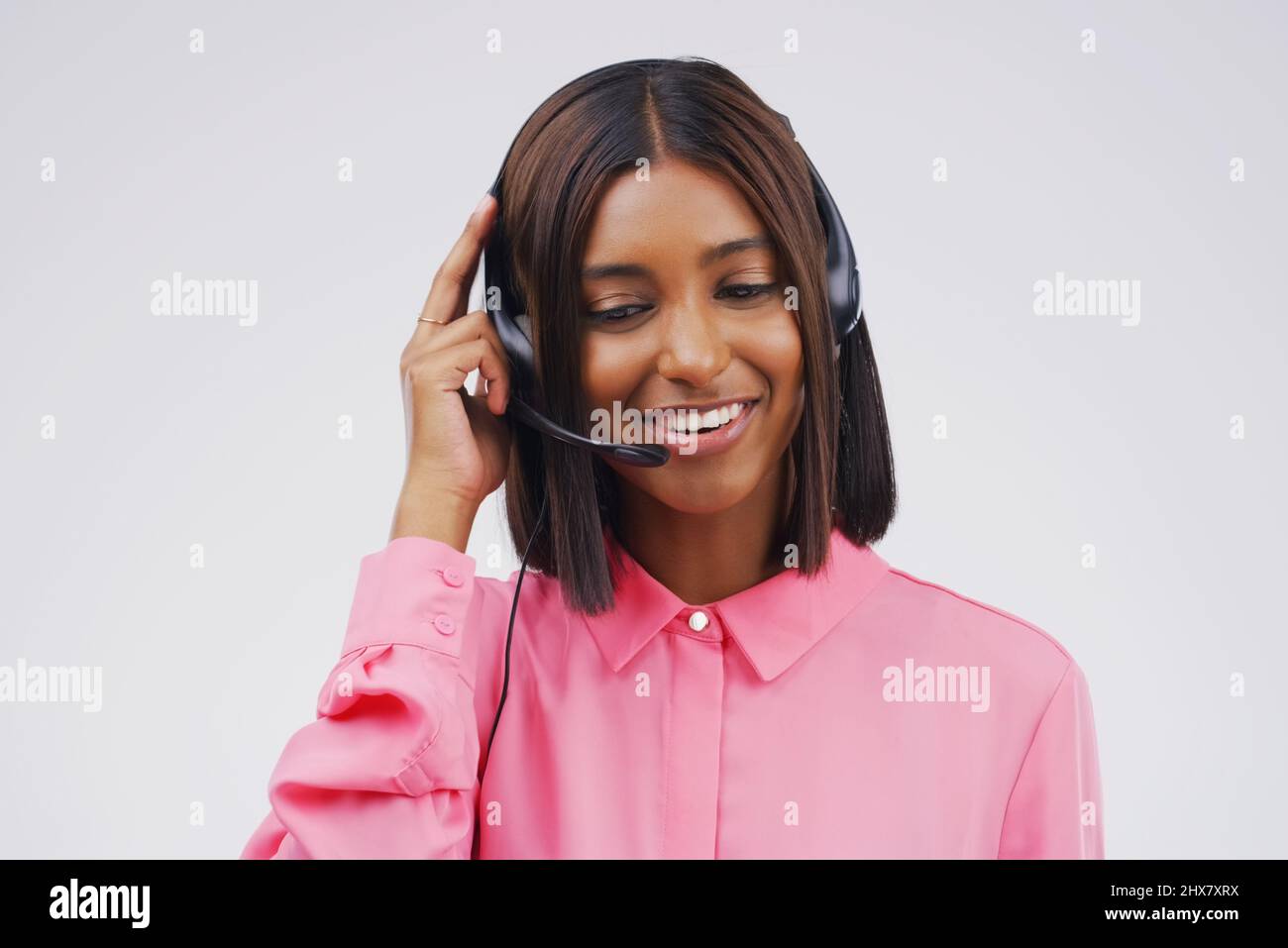 Shes a dedicated customer service representative. Studio shot of an ...