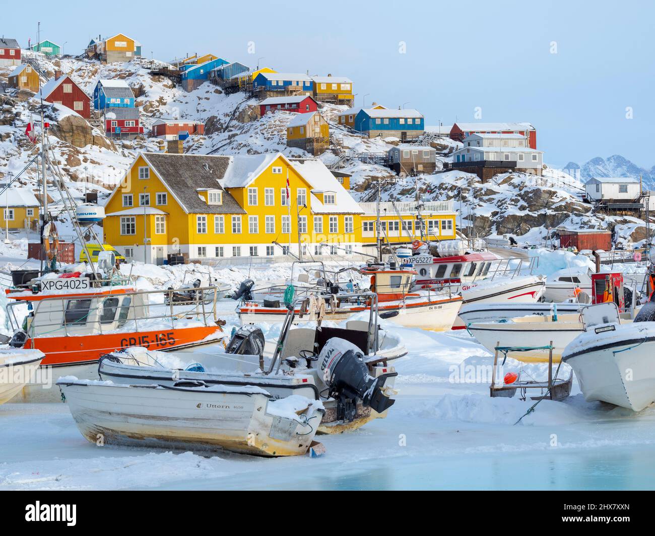 The frozen harbour of Uummannaq during winter in northern Westgreenland ...