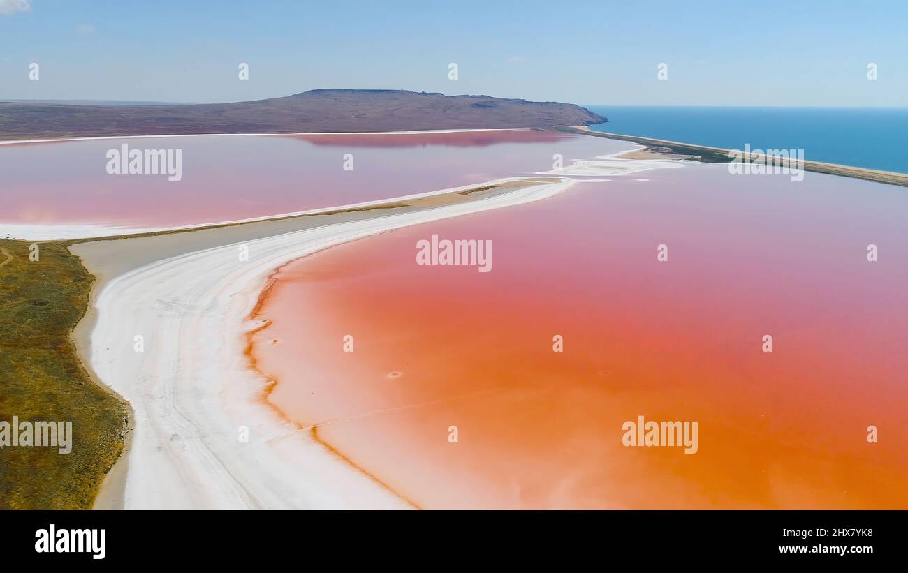 Top view of pink lakes on blue sea background. Shot. Bright colorful ...