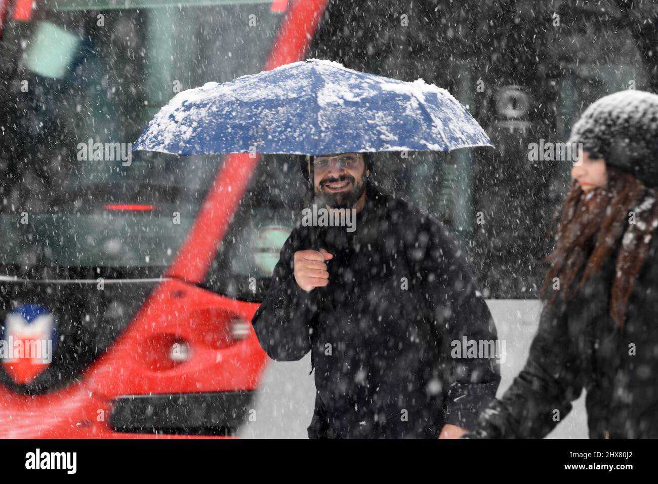 Istanbul, Turkey. 10th Mar, 2022. Pedestrians walk in the snow in ...