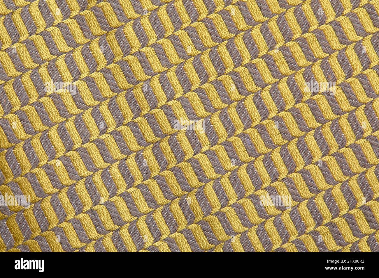 fabric in golden color with geometric patterns. mustard knitted texture ...