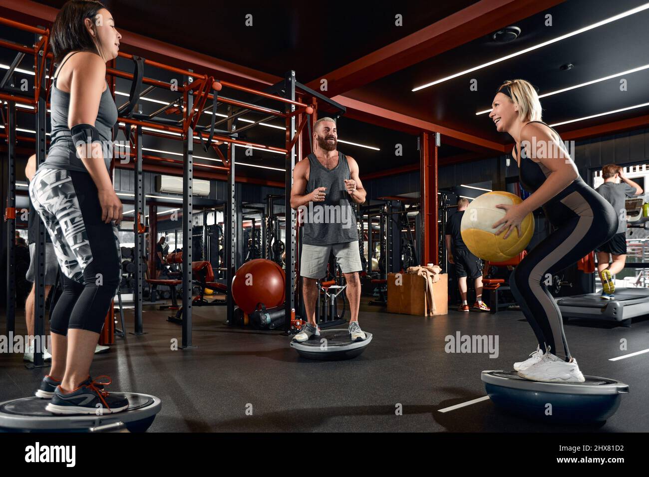 The guy tries to keep his balance on the balancing platform with ...