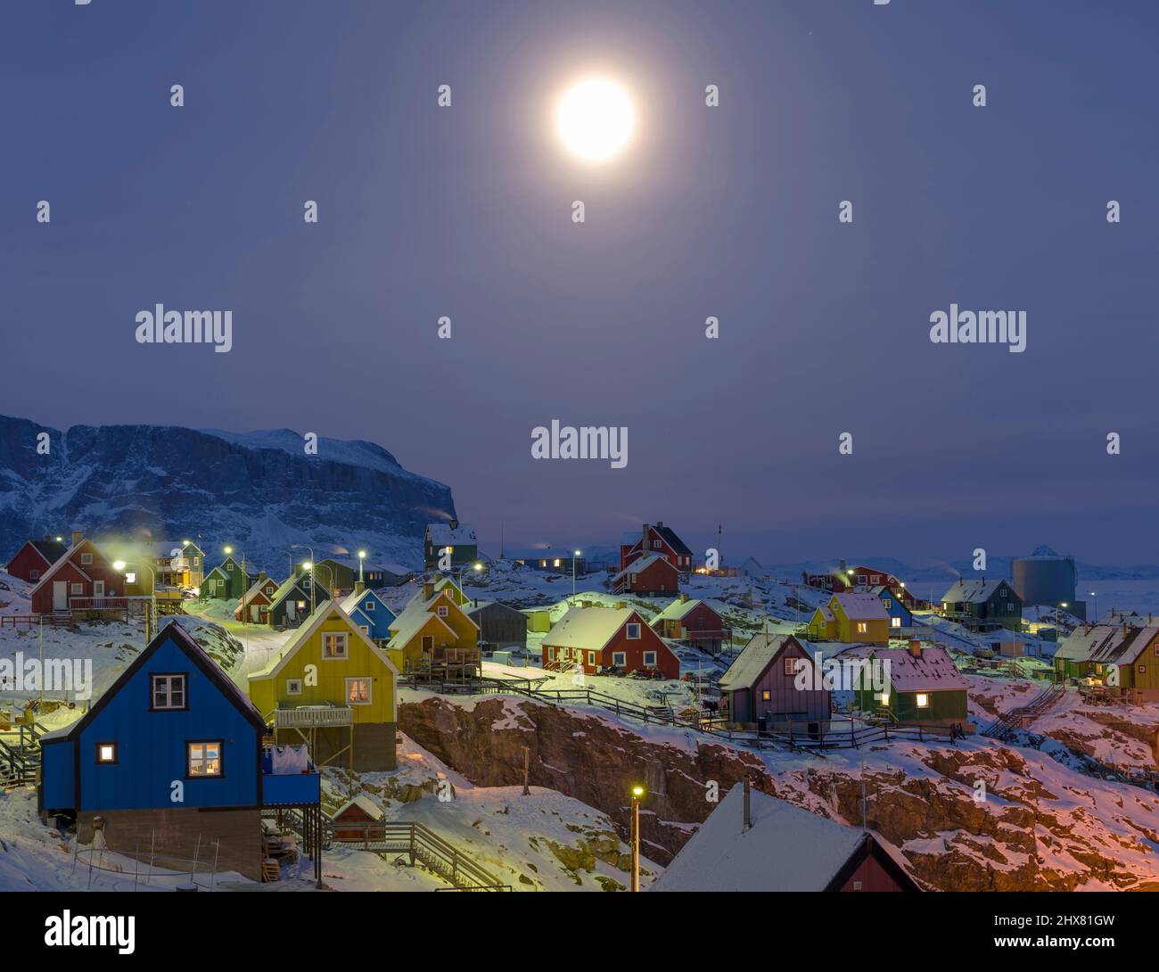Arctic night and full moon over Uummannaq during winter in northern ...