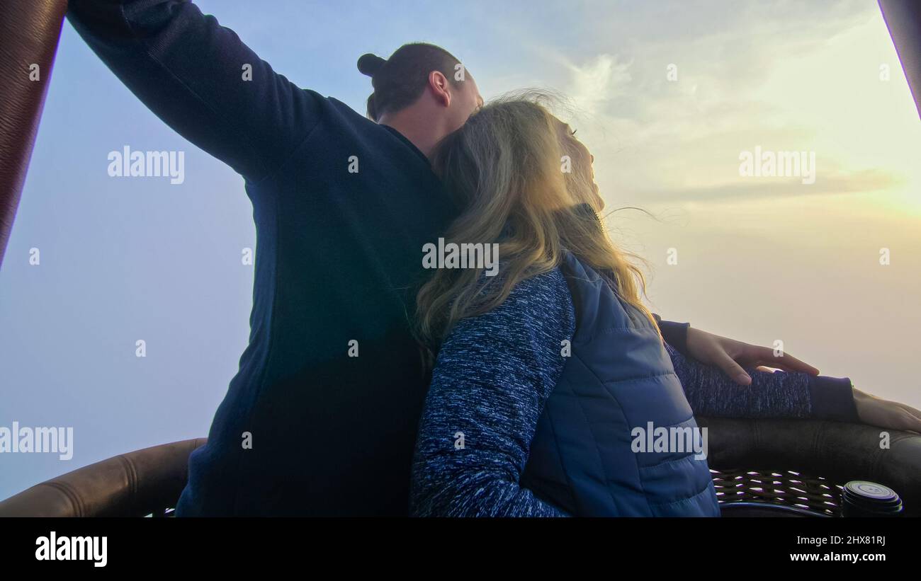 Adventure love couple on hot air balloon watermelon. Man and woman kiss ...