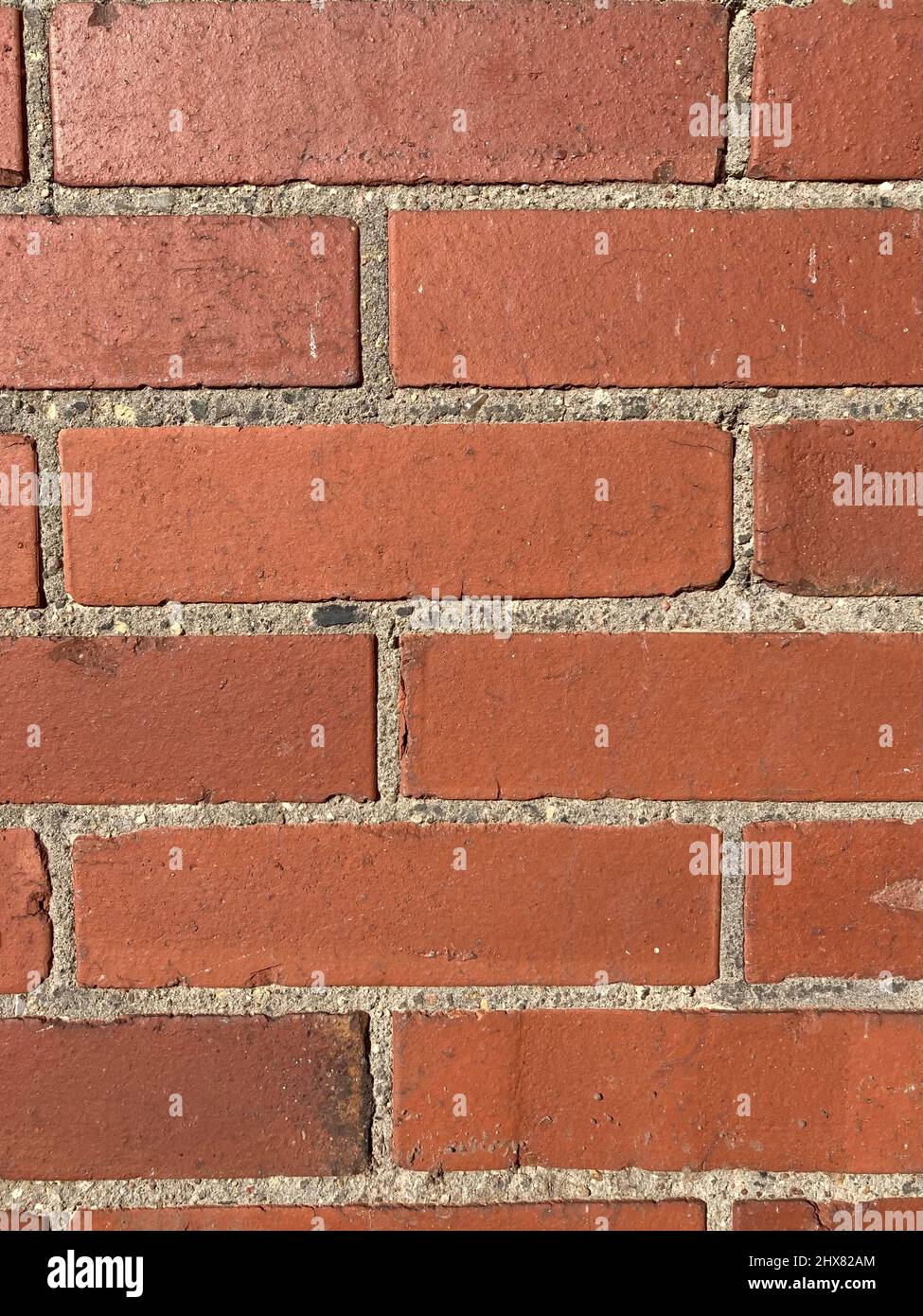 a reddish brown brick wall as background Stock Photo - Alamy