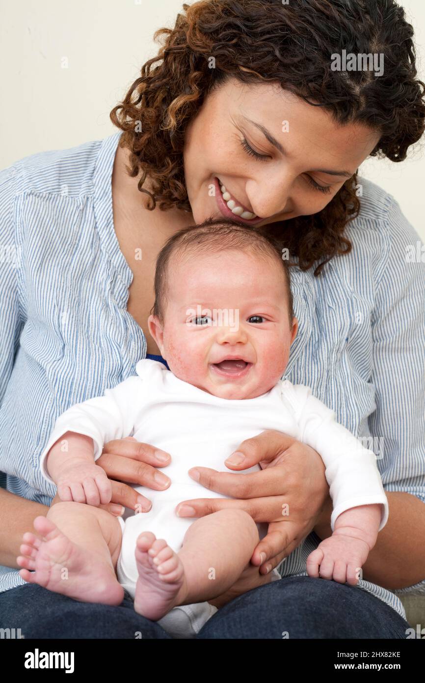 Son sitting on mothers lap hi-res stock photography and images - Alamy