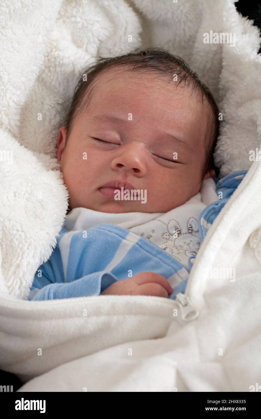 Baby curled up hi-res stock photography and images - Alamy