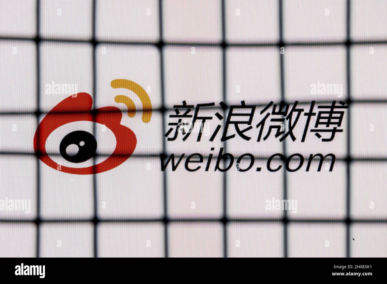 The logo of Weibo chinese microblogging service behind bars. The concept of Weibo censorship and ...