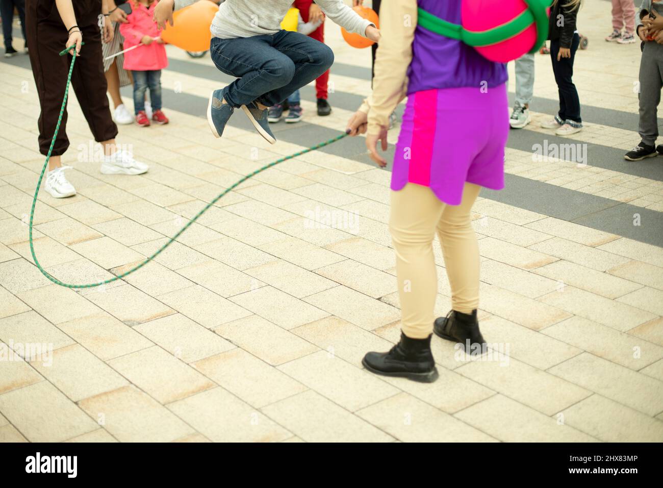 Children jumping rope hi-res stock photography and images - Alamy